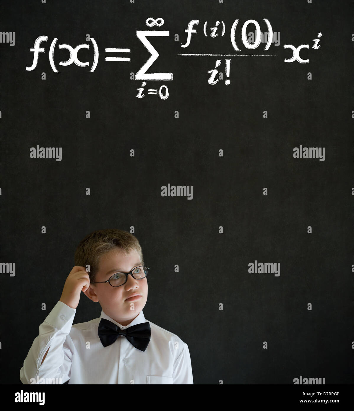 Scratching head thinking boy dressed up as business man with maths ...