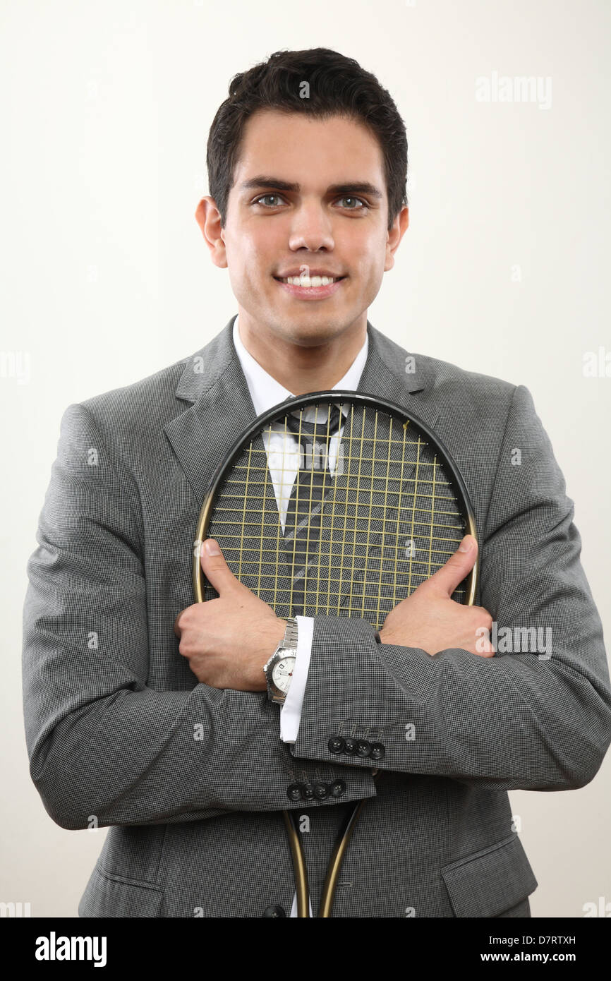young business man with tennis racket Stock Photo - Alamy