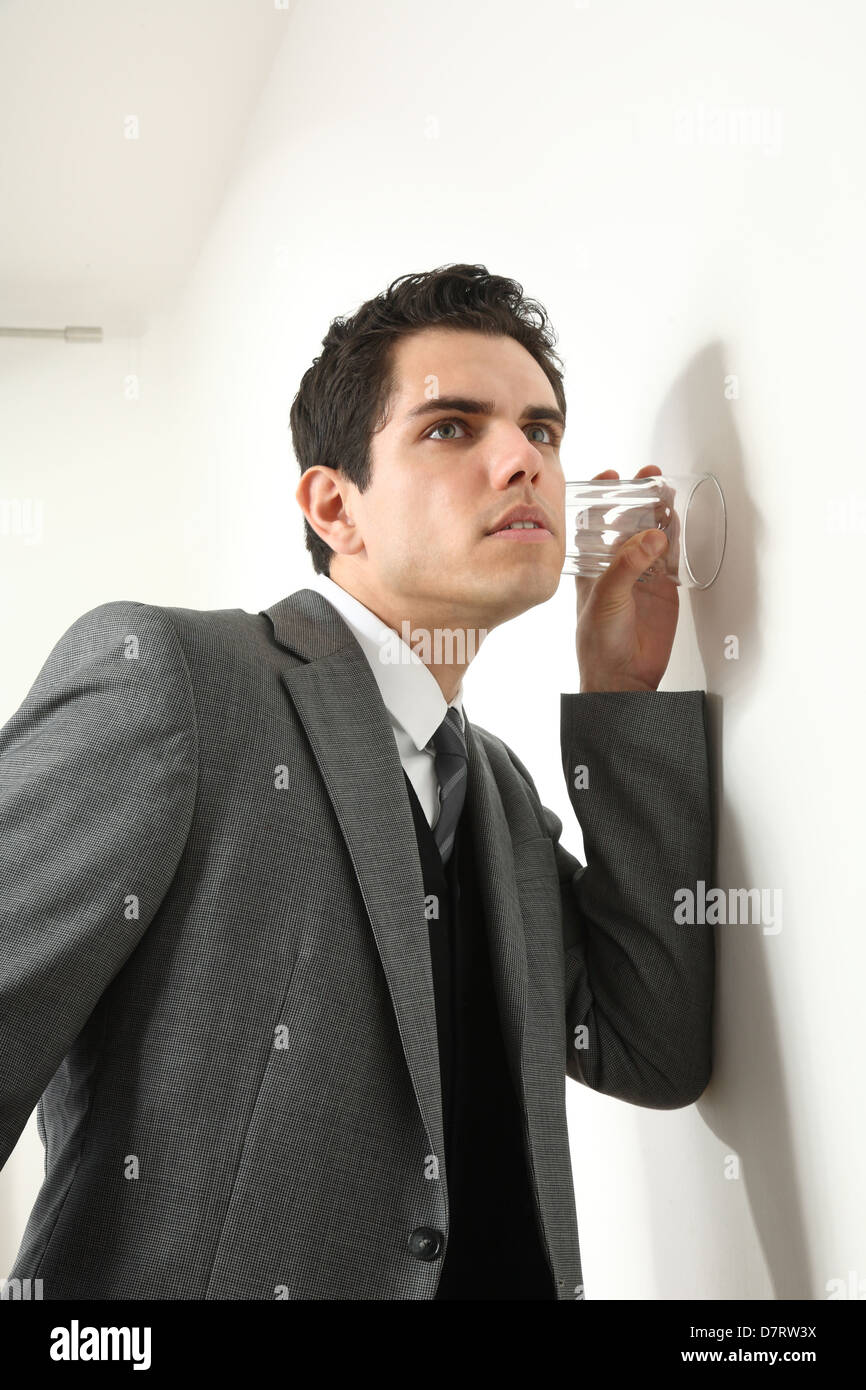 Glass to wall eavesdrop hi-res stock photography and images - Alamy