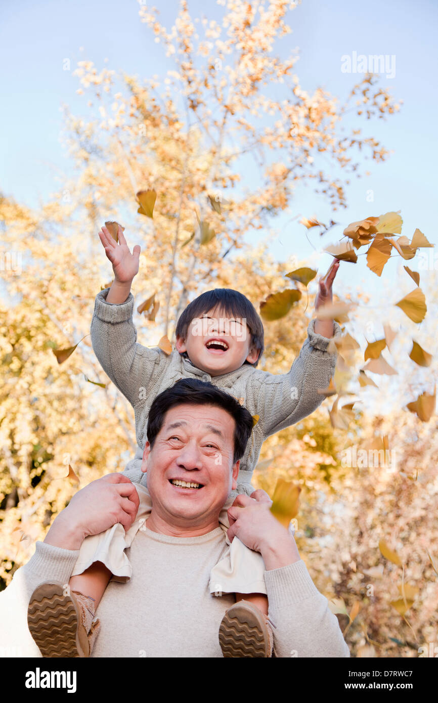Grandfather and Grandson Playing in the Park Stock Photo - Alamy