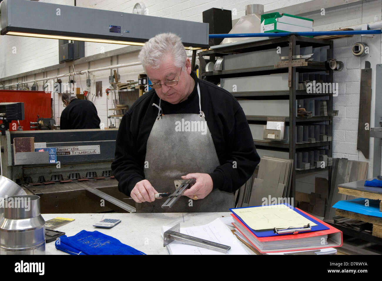 sheet-metal worker in workshop Stock Photo - Alamy