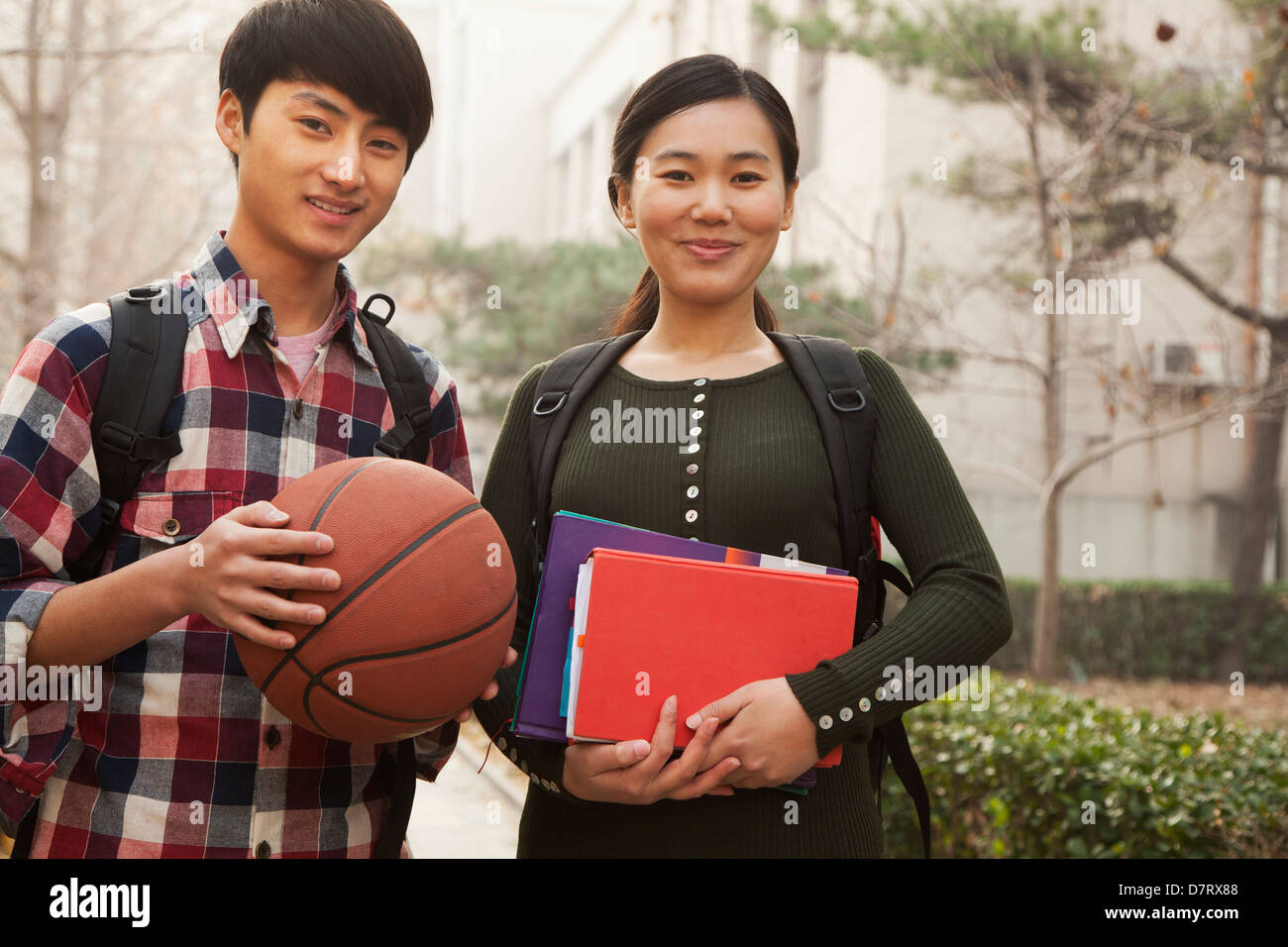 Two students portrait on college campus Stock Photo - Alamy