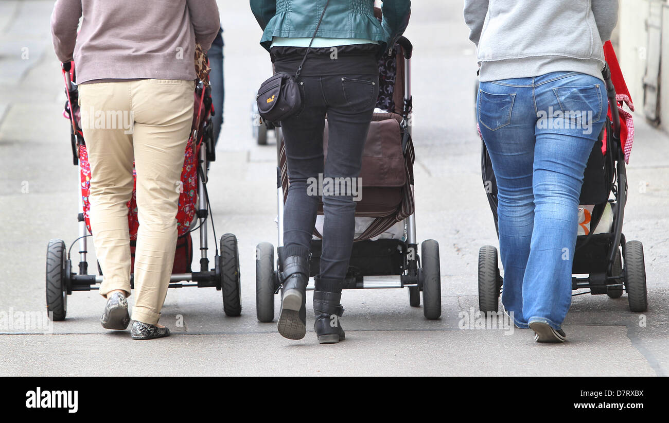 Three young women push their babies in prams in Augsburg, Germany, 07 ...