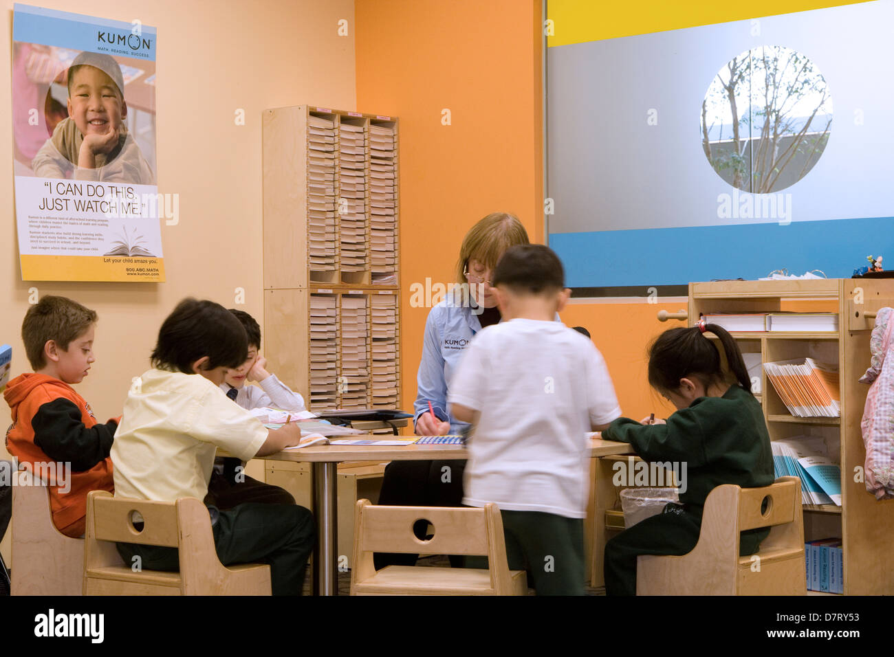 young Kumon students in classroom with teacher Stock Photo - Alamy