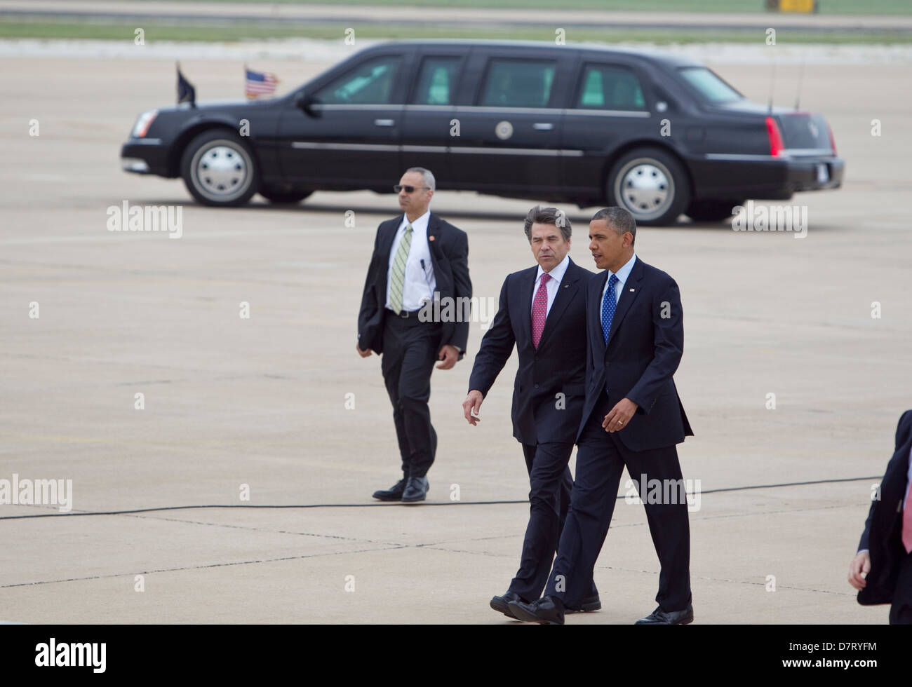 President of the United States, Barack Obama, walks along tarmac of the ...