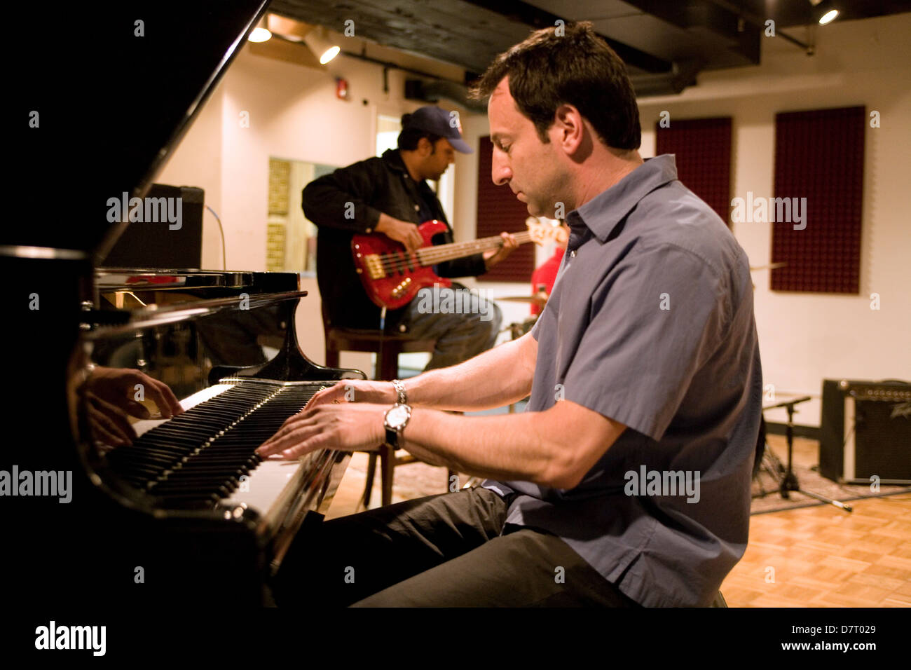 Musicians in recording studio Stock Photo - Alamy