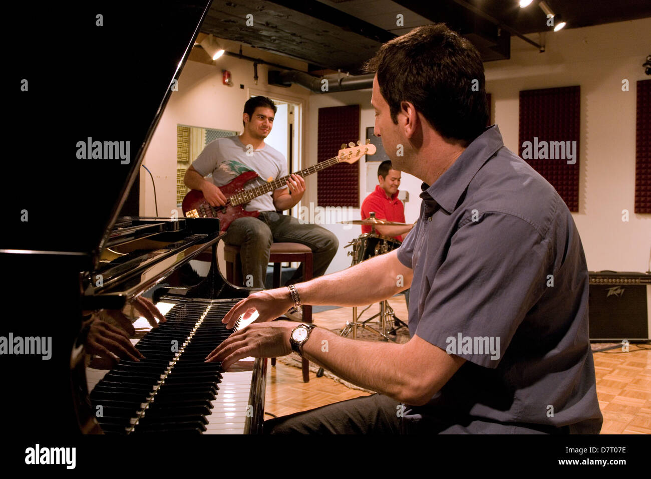 Musicians in recording studio Stock Photo - Alamy