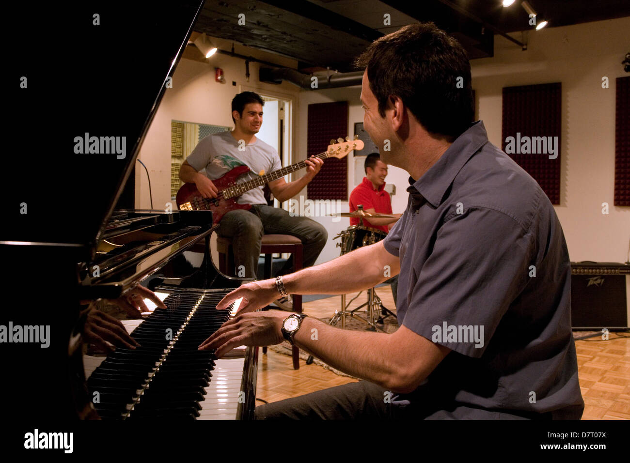 Musicians in recording studio Stock Photo - Alamy