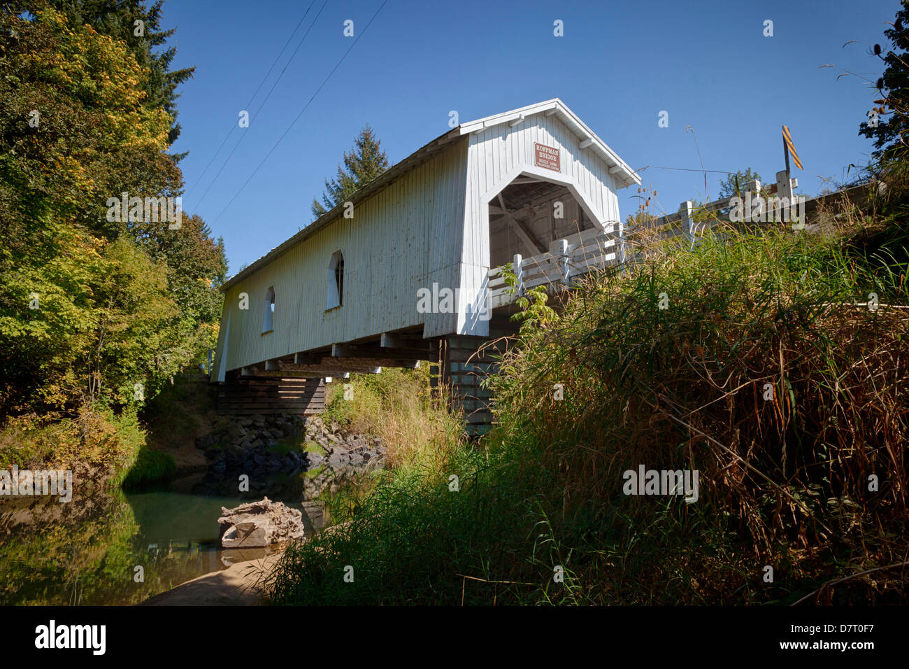 USA, Oregon, Scio, Hoffman Bridge across Crabtree Creek in early Autumn ...