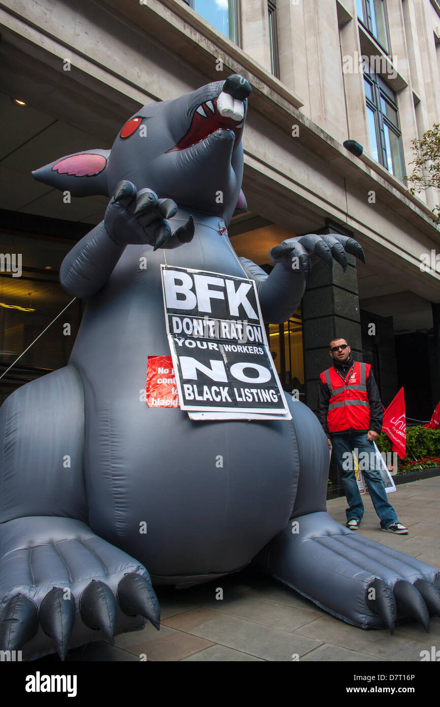 London, UK. 13th May, 2013. A giant inflatable rat adds visual impact ...