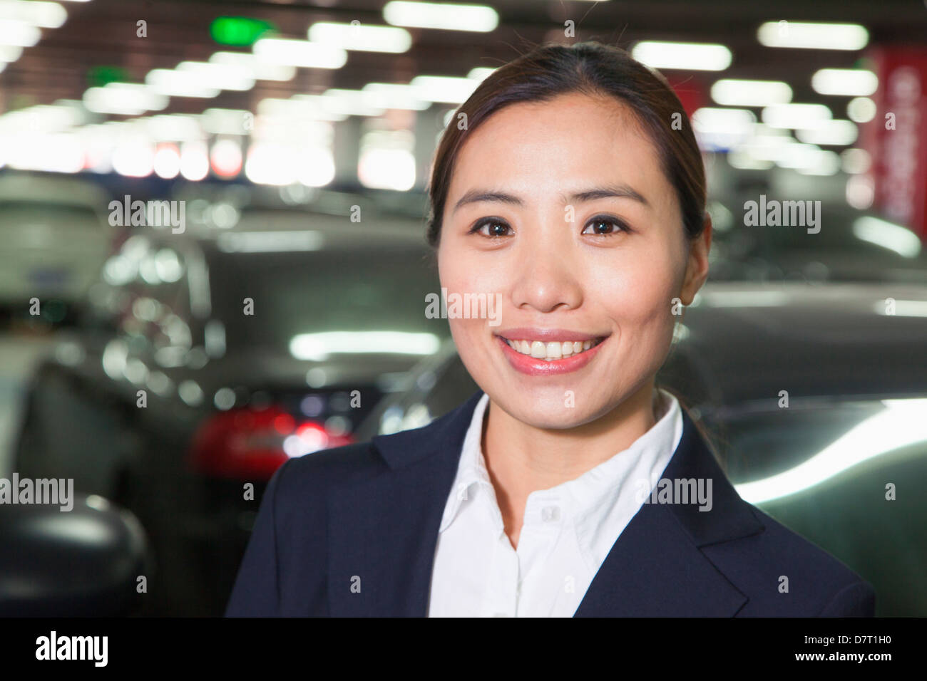 Traveler smiling portrait in airport parking lot Stock Photo - Alamy