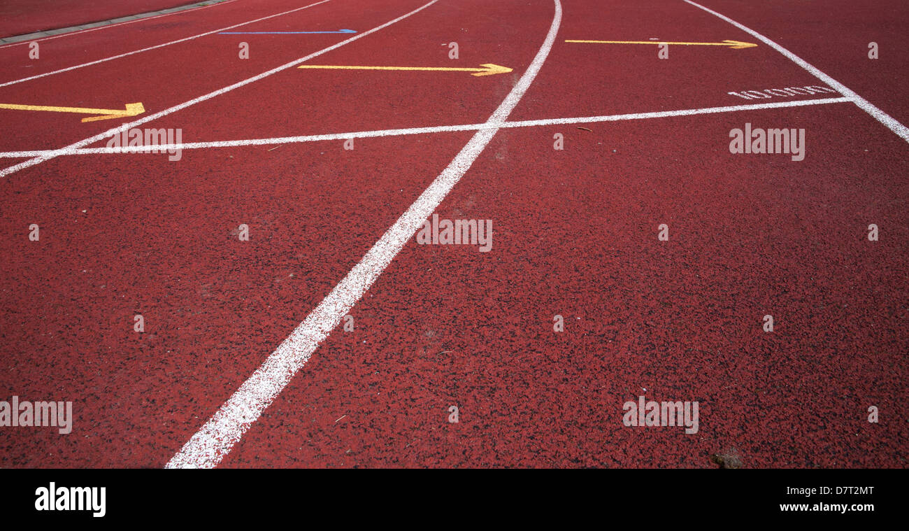 Red race track with white lines and arrows and numbers Stock Photo - Alamy