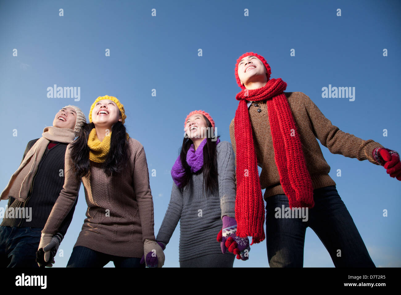 Friends on ice rink Stock Photo - Alamy