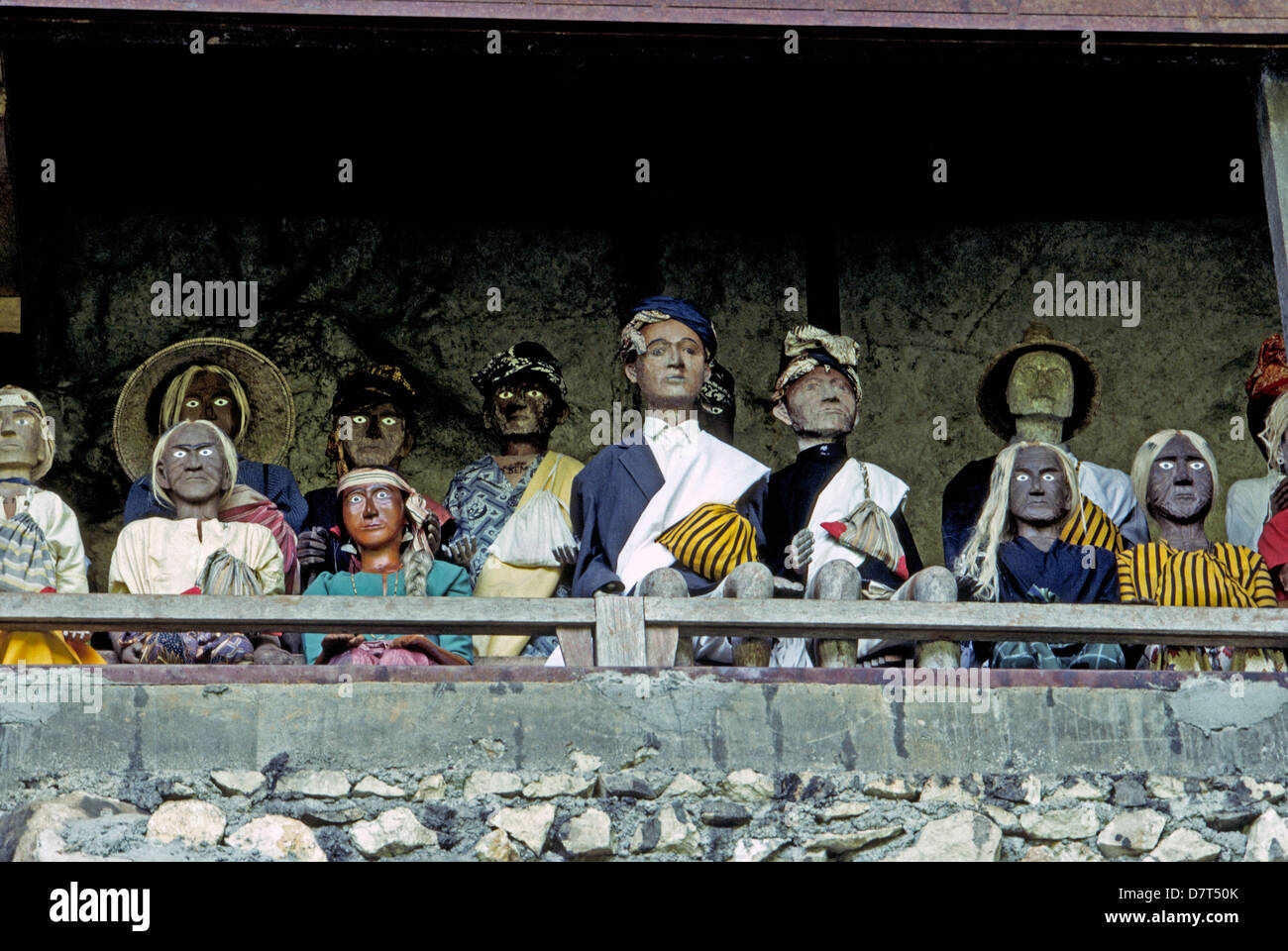 Wooden effigies of the dead, called tau-tau, protect burial sites ...