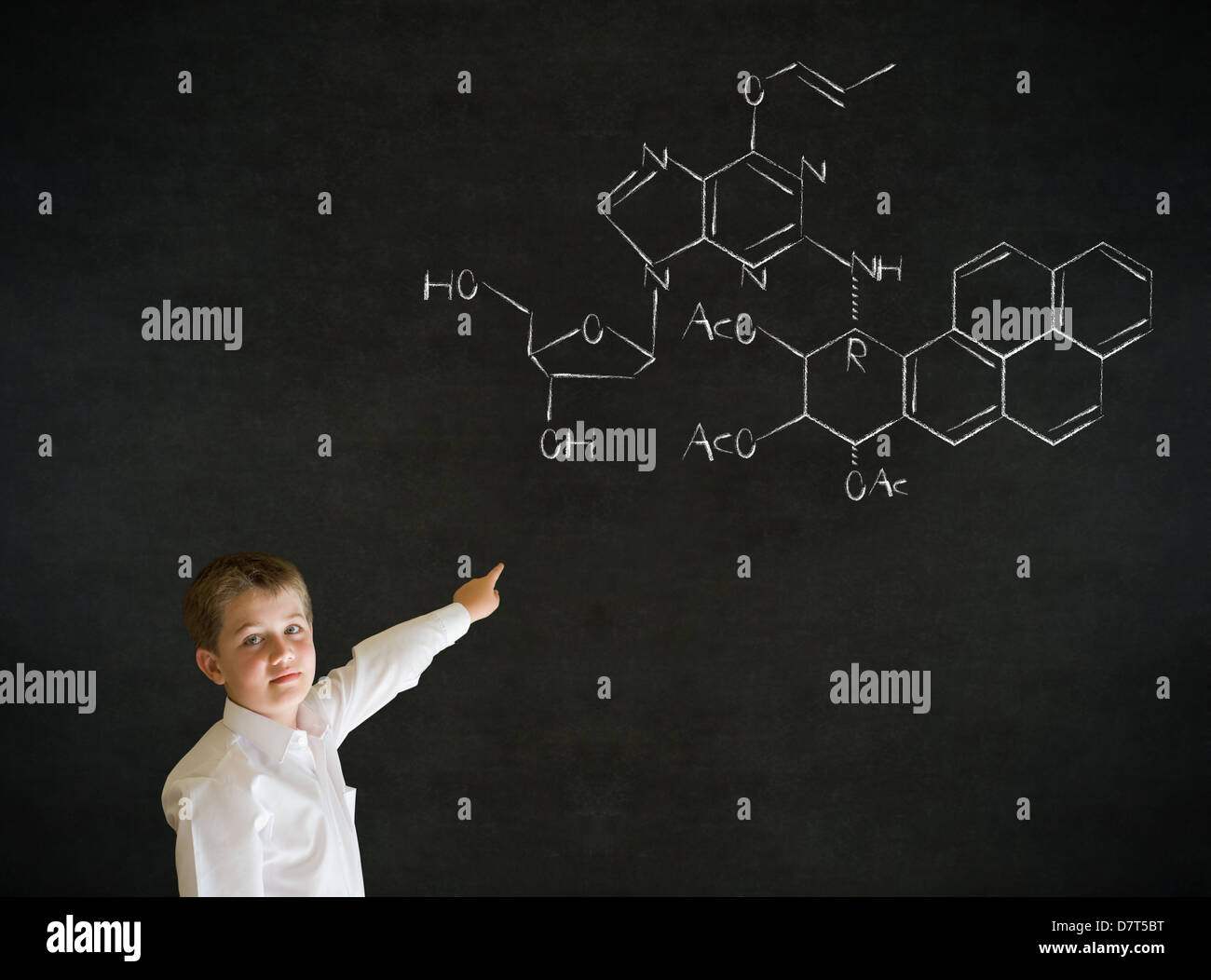 Pointing boy dressed up as business man with science or chemistry ...