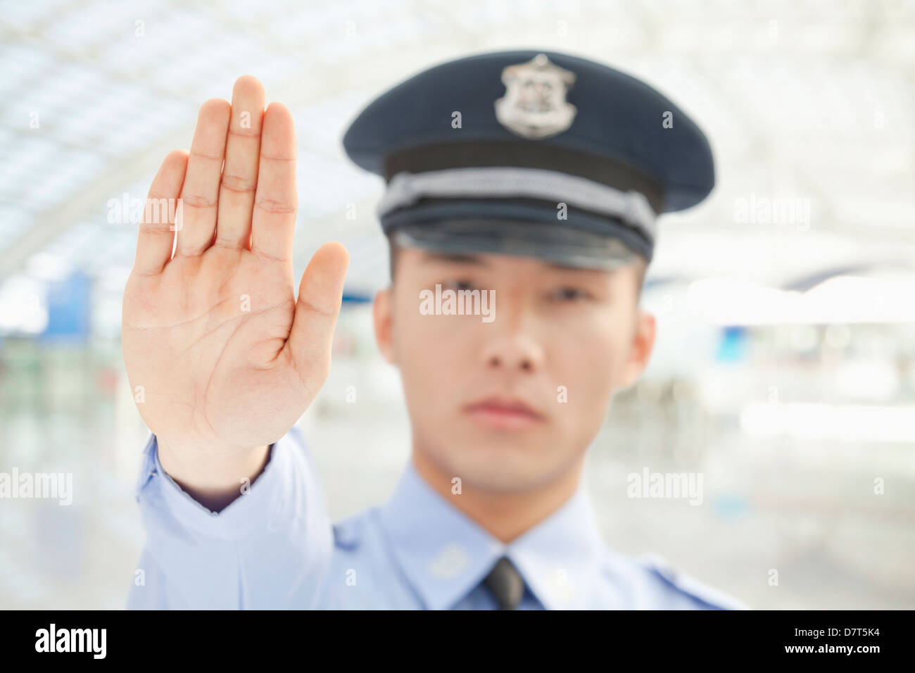 Police Officer Motioning to Stop Stock Photo - Alamy