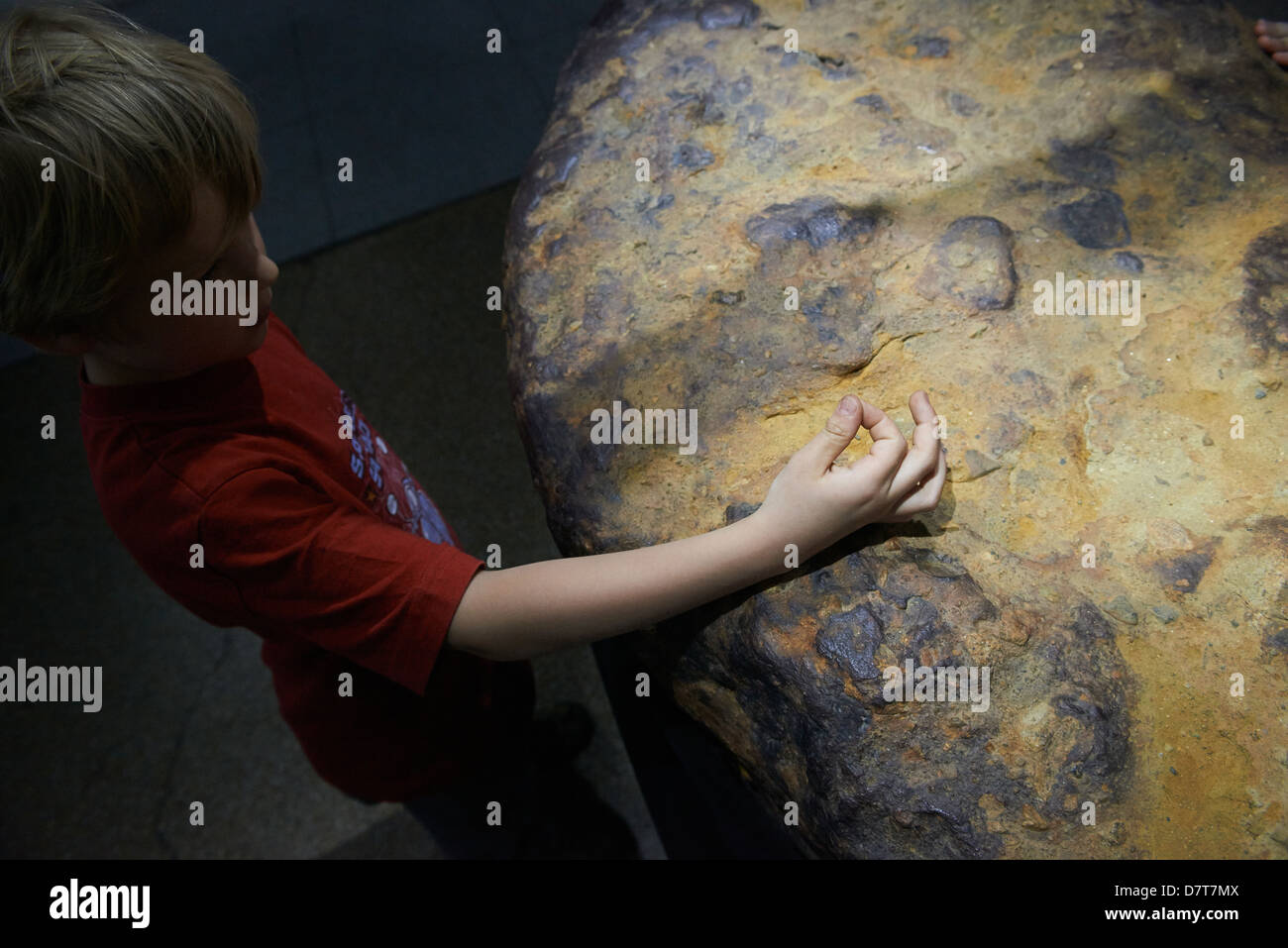 Small Child Boy touching Meteorite MUONIONALUSTA Stock Photo - Alamy