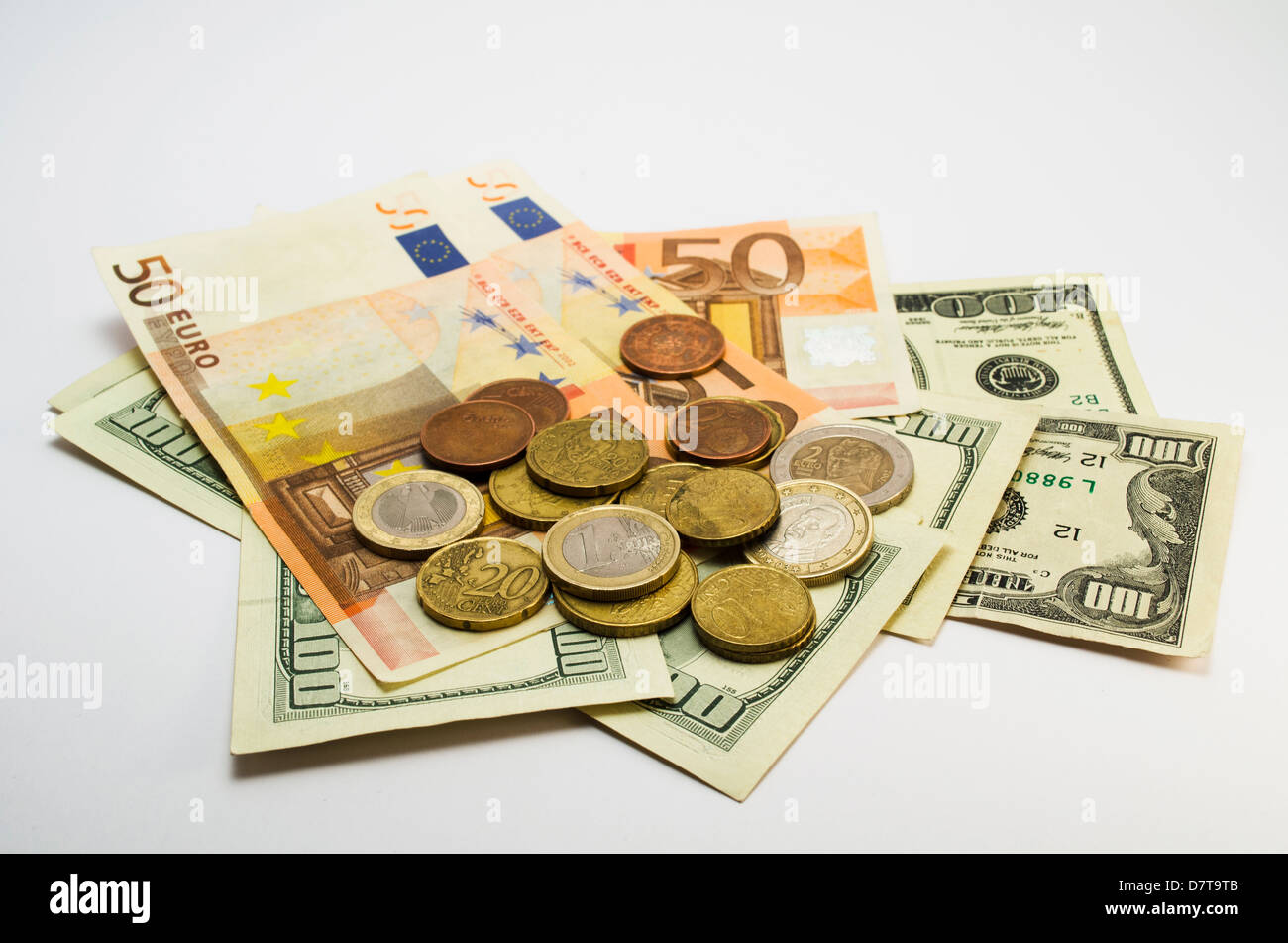 notes and coins lie on a white background Stock Photo - Alamy