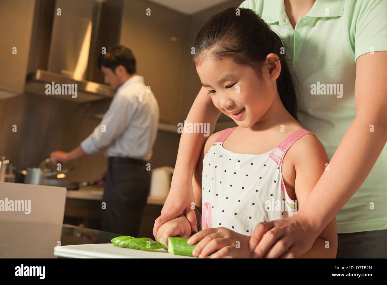 Family preparing dinner Stock Photo - Alamy