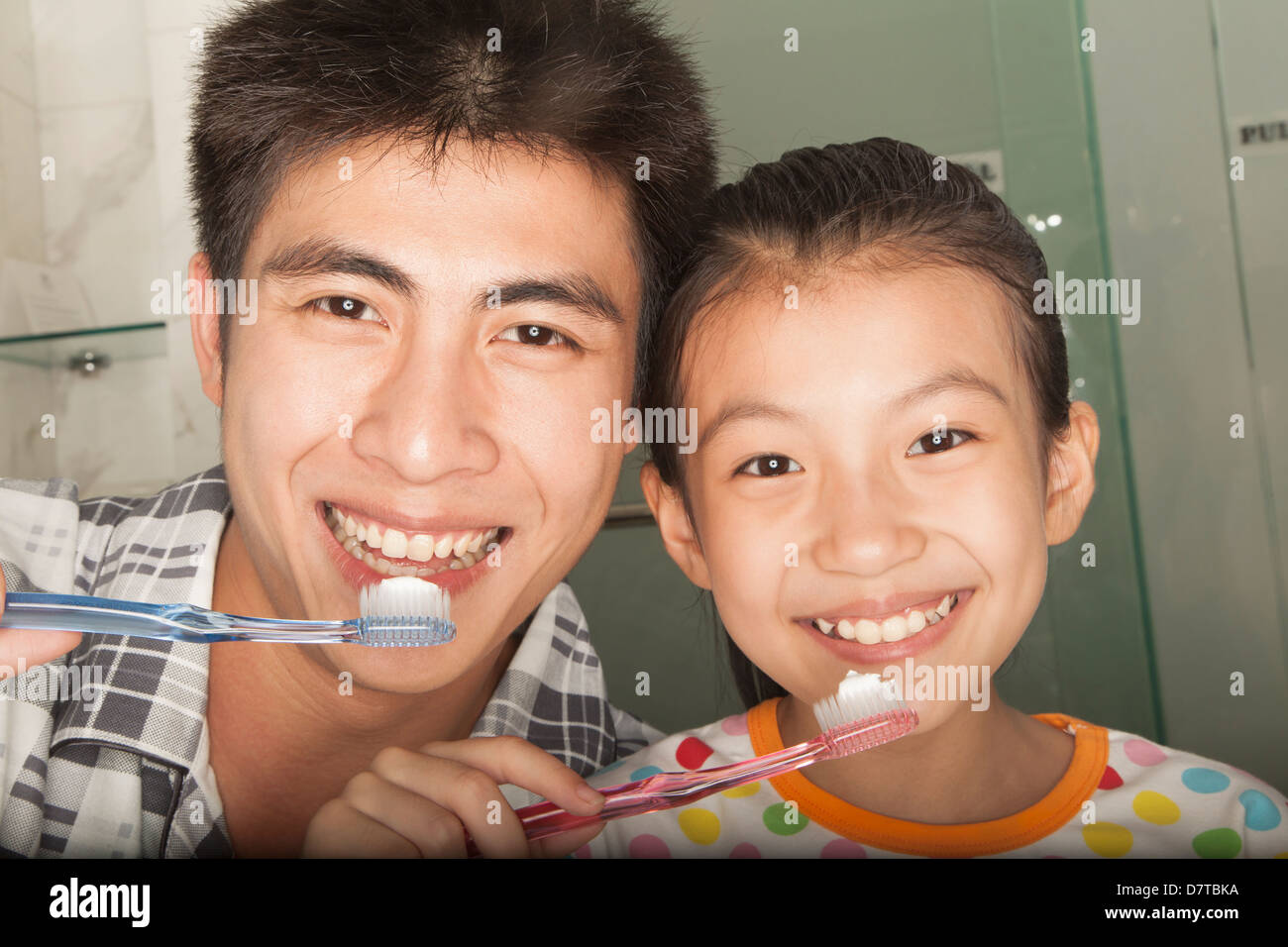 Father and Daughter Brushing Teeth Together Stock Photo - Alamy