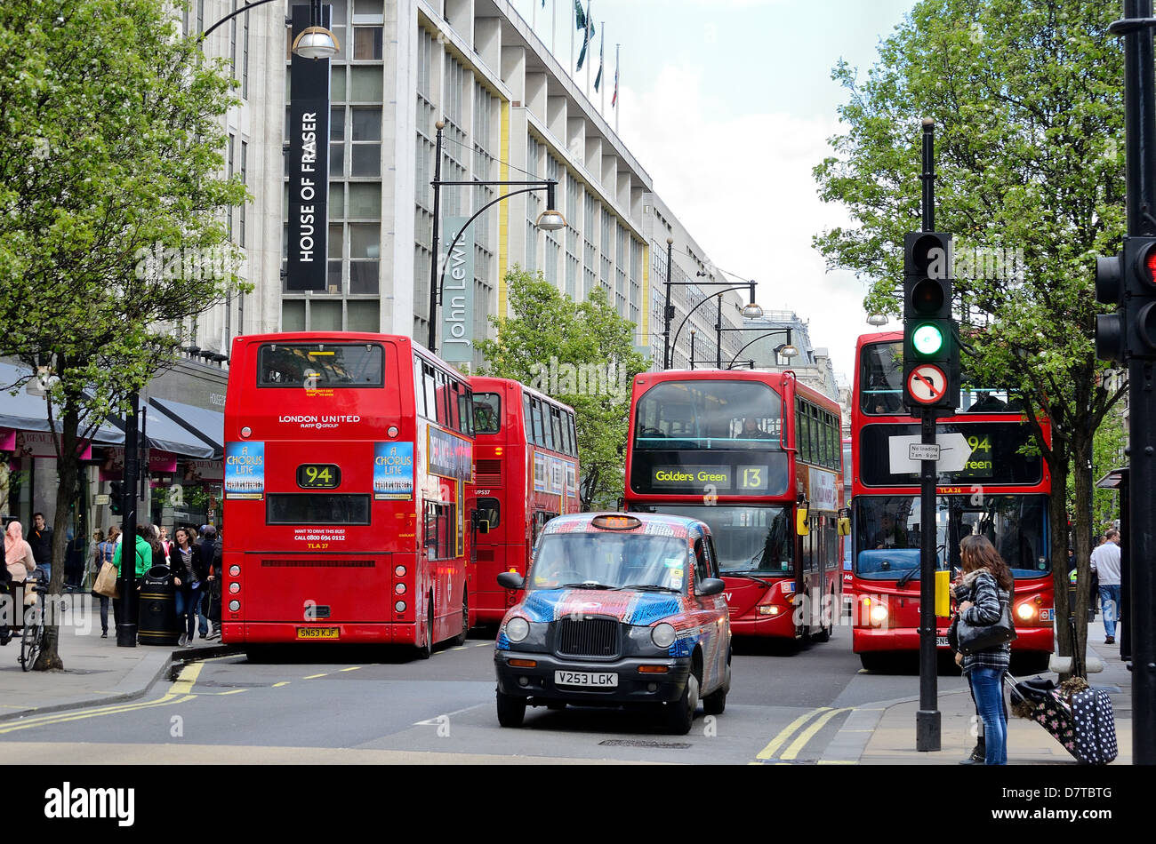 Red London buses in a busy Oxford Street Stock Photo - Alamy