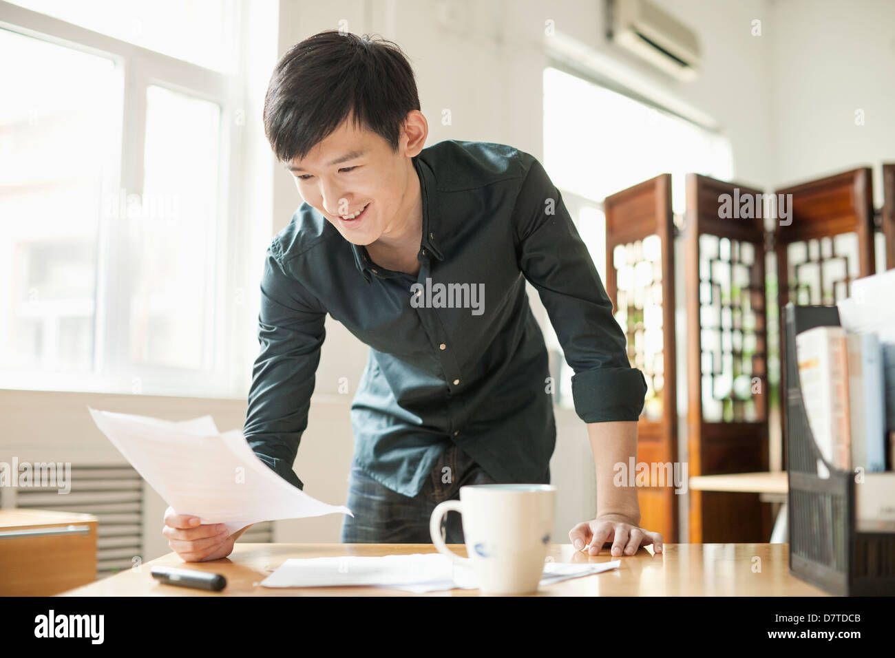 Young Man Working in Creative Office Stock Photo - Alamy