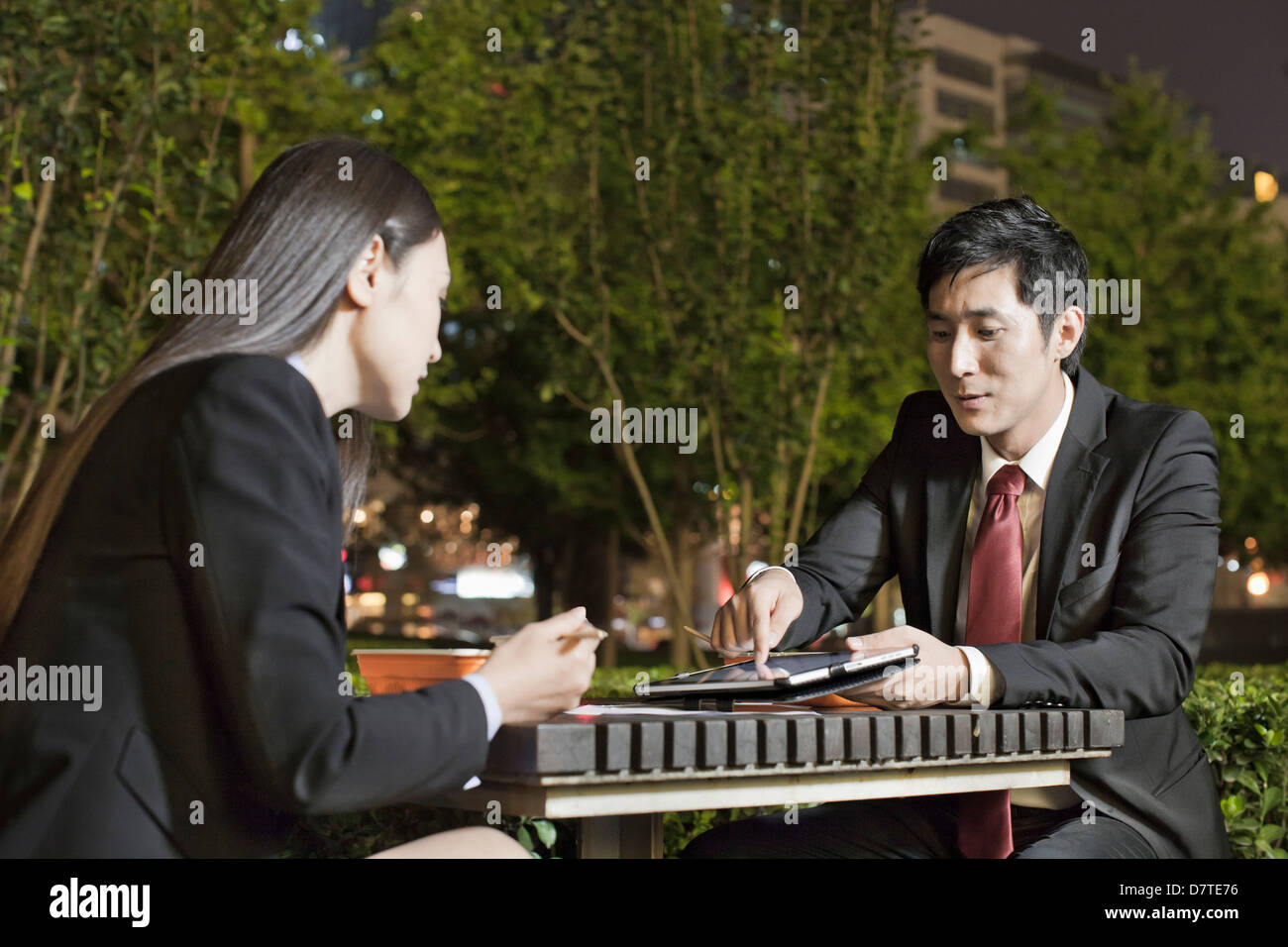 Business People Working While Having Dinner Stock Photo - Alamy
