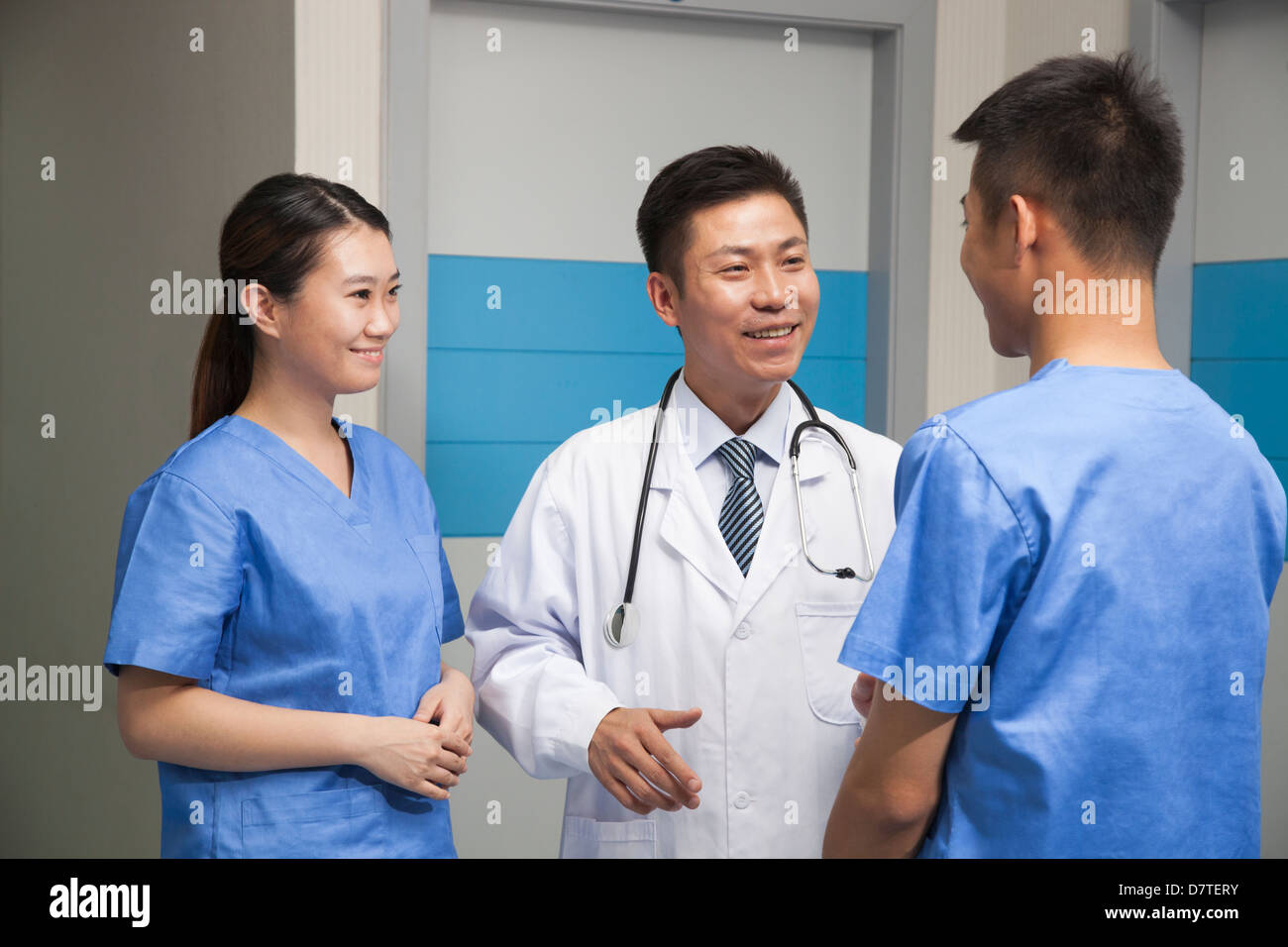 Medical Team Talking In Hospital Stock Photo - Alamy