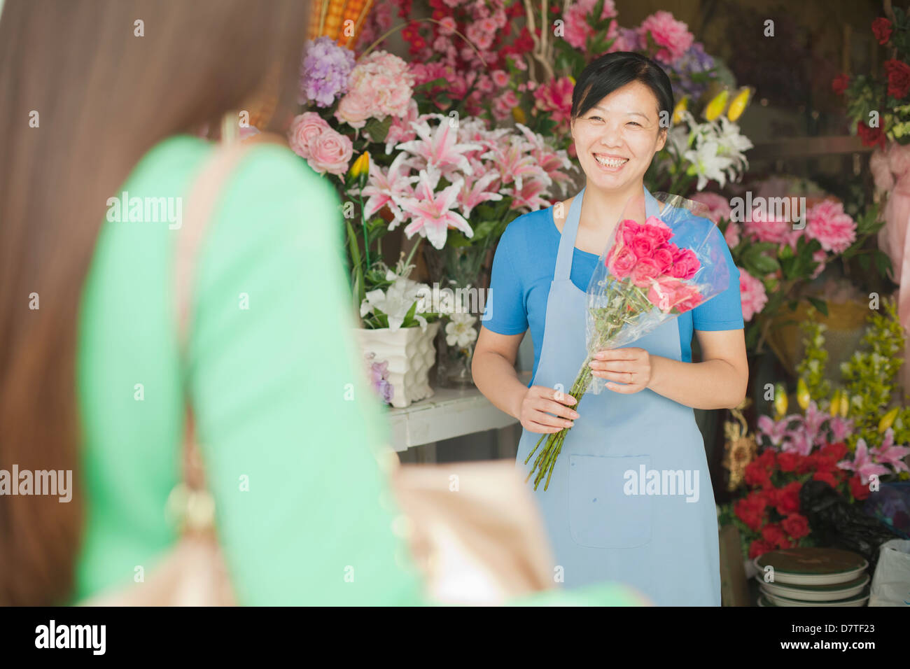 Chinese people giving flowers hi-res stock photography and images - Alamy