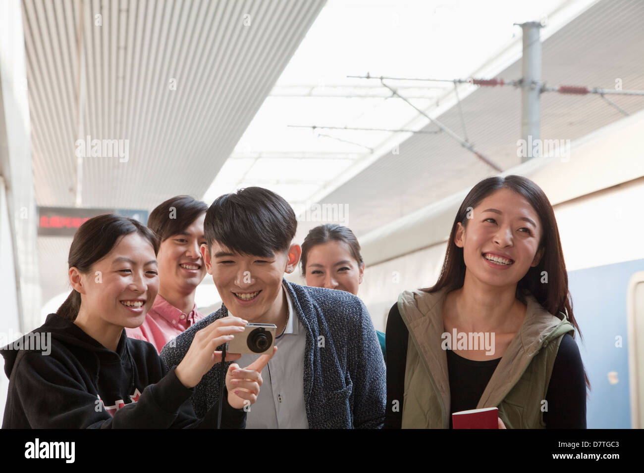Young friends standing train station hi-res stock photography and ...