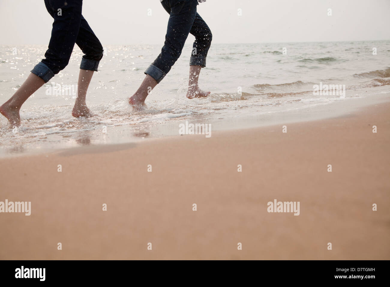 Running away from waves hi-res stock photography and images - Alamy