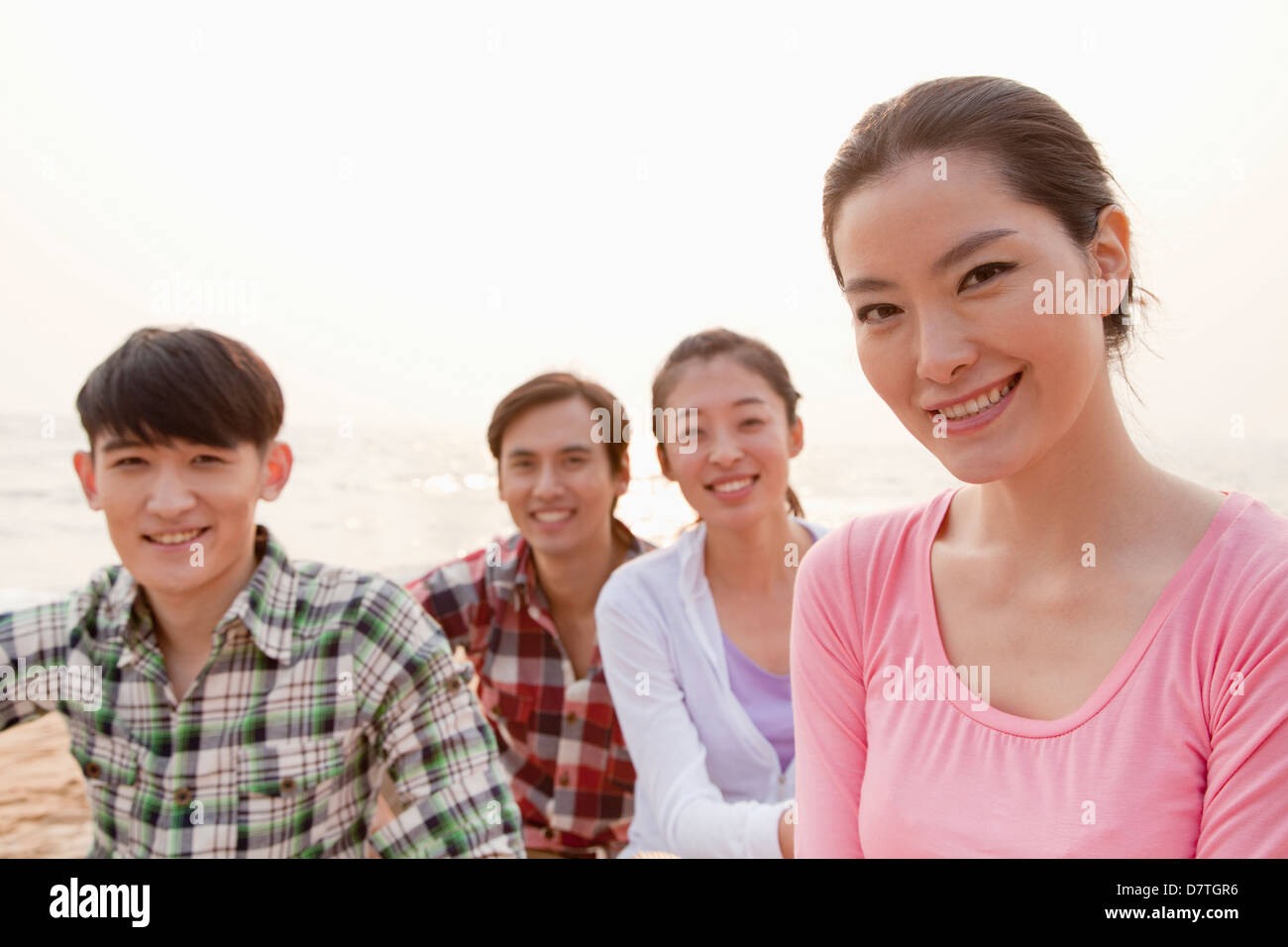 Group of Friends by the Sea Stock Photo - Alamy