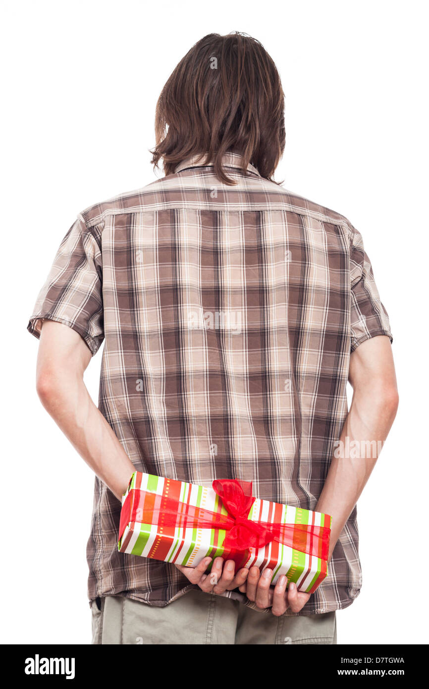 Rear view of a man holding small gift box, isolated on white background ...