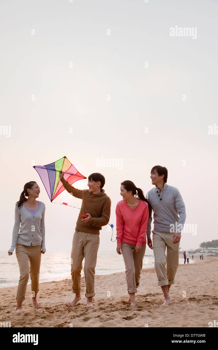 Young friends flying kite on hi-res stock photography and images - Alamy