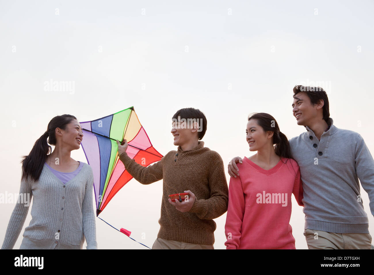 Young friends flying kite on hi-res stock photography and images - Alamy