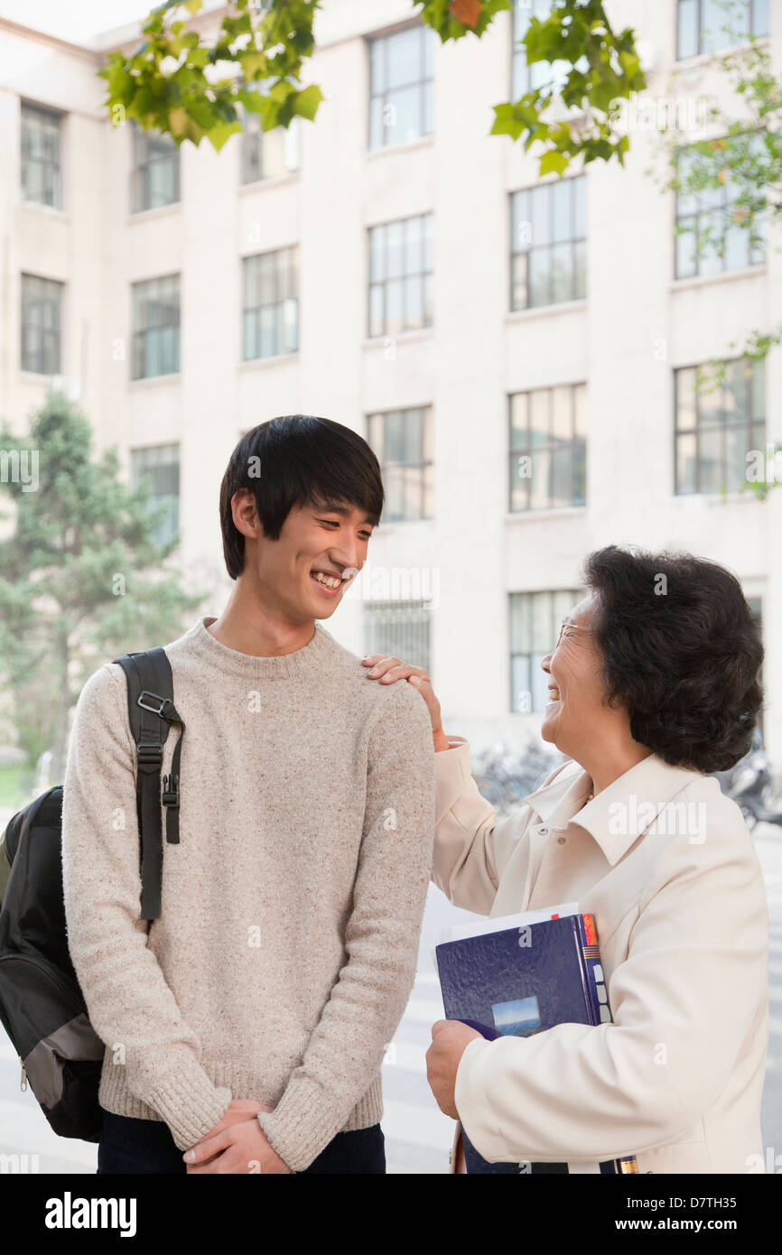 Student talking teacher walking hi-res stock photography and images - Alamy