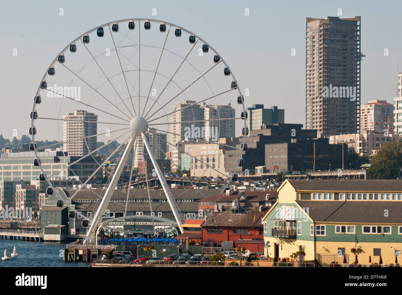 USA, WA, Seattle. Dramatic downtown waterfront with Seattle Great Wheel ...