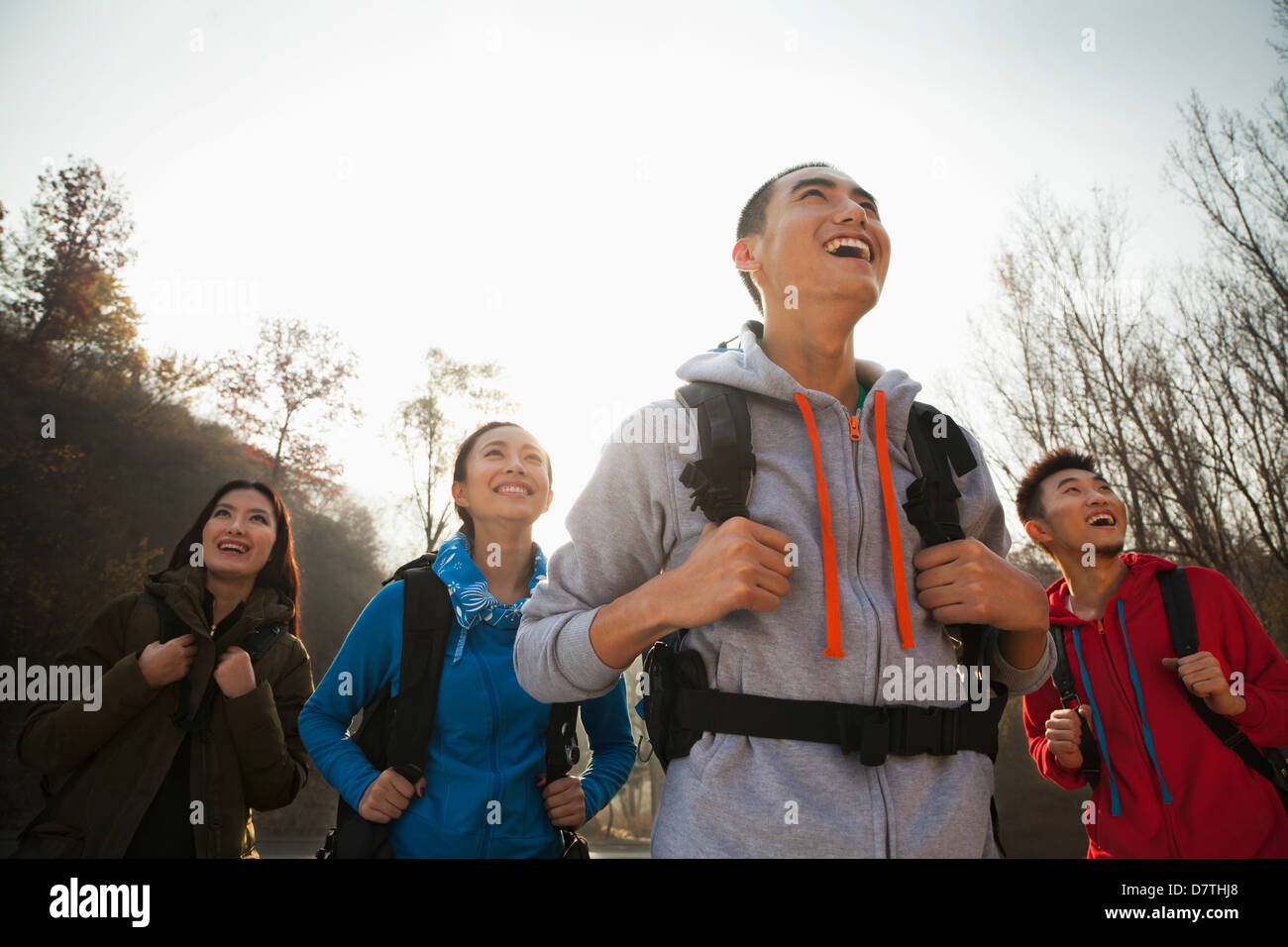 Group of young people hiking Stock Photo - Alamy