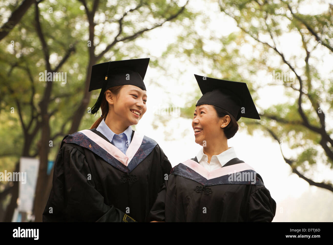 Professor and Graduate Walking On Campus Stock Photo - Alamy