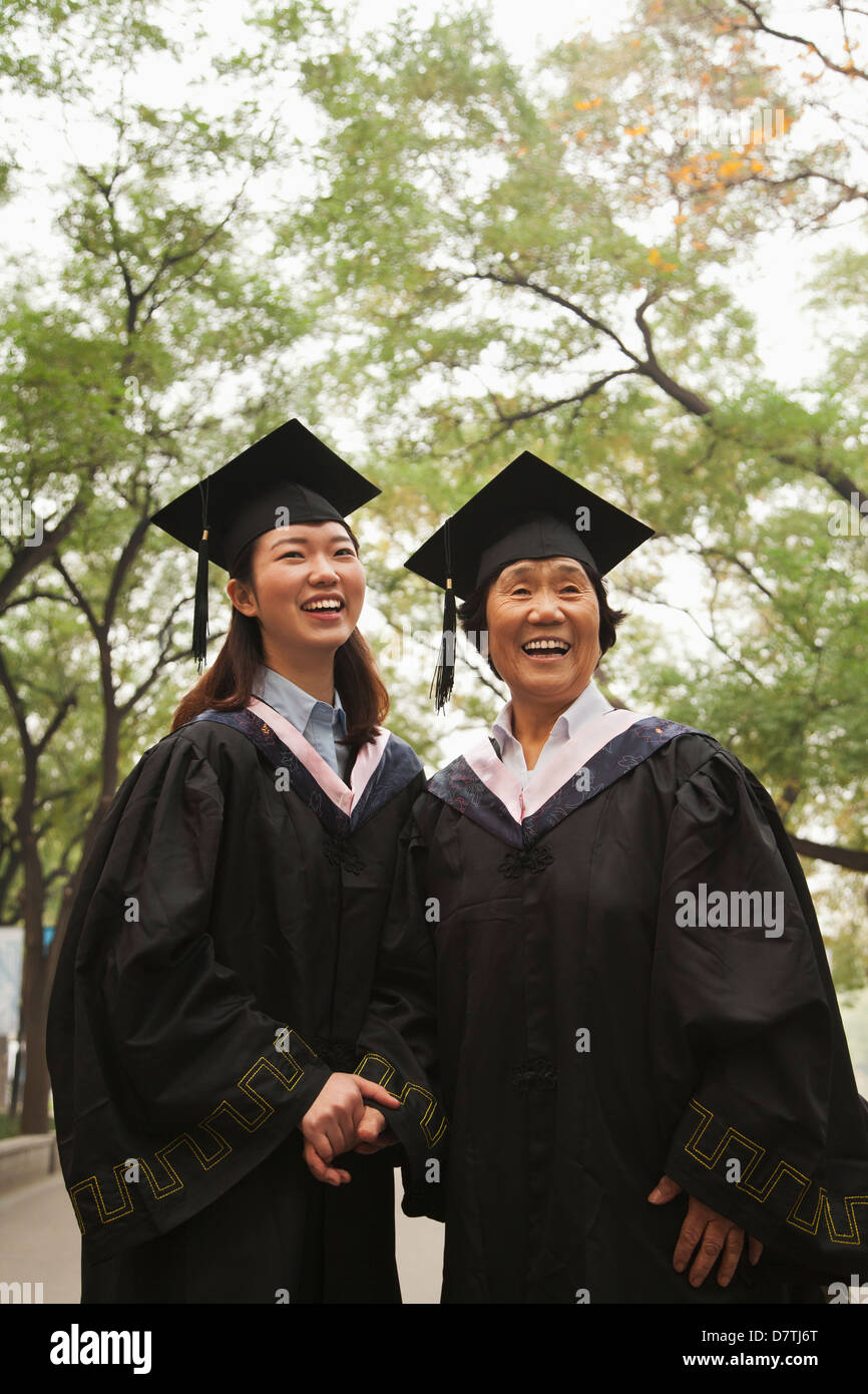 Professor and Graduate Walking On Campus Stock Photo - Alamy