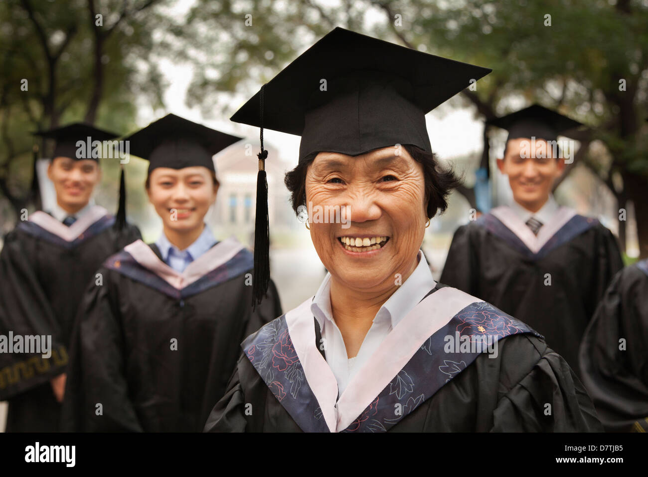 Professor and Graduates Stock Photo - Alamy