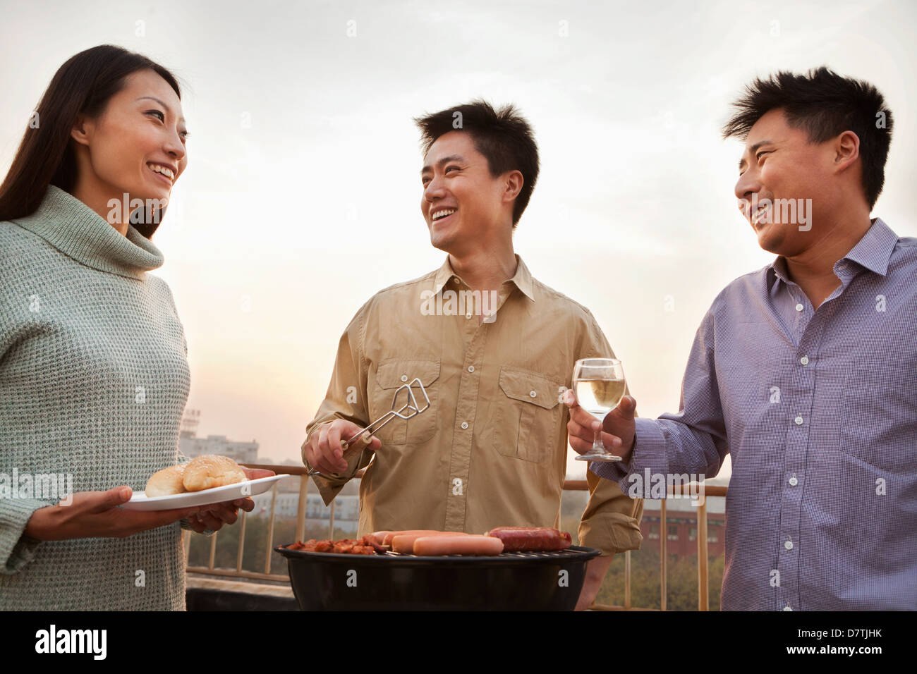Friends Drinking Over a Barbecue Stock Photo - Alamy