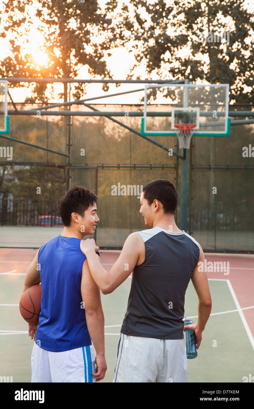 Friends going back home after basketball game Stock Photo - Alamy
