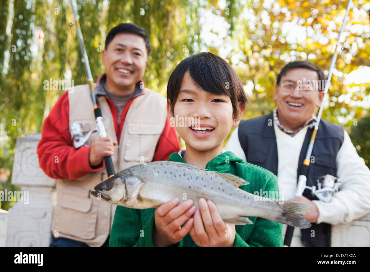 Multi-generational men fishing portrait Stock Photo - Alamy