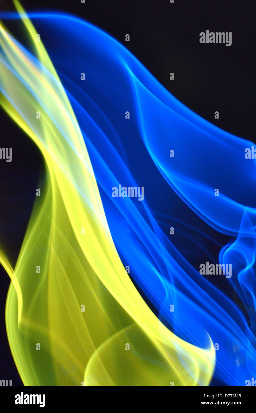 Blue and yellow smoke Stock Photo - Alamy