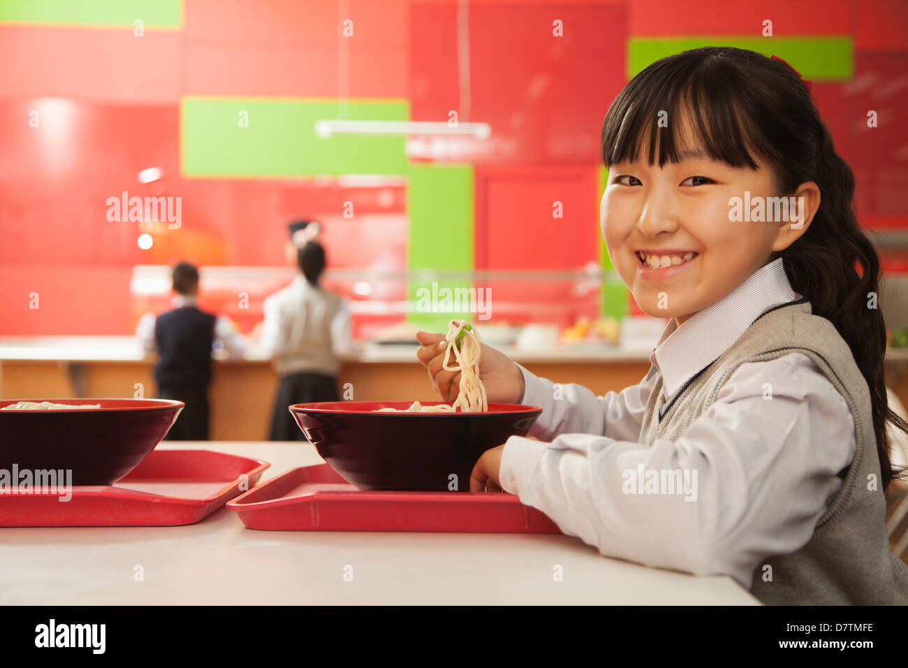 China chinese girl eating noodles hi-res stock photography and images ...