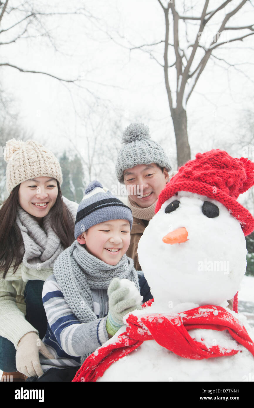 Chinese child making snowman hi-res stock photography and images - Alamy