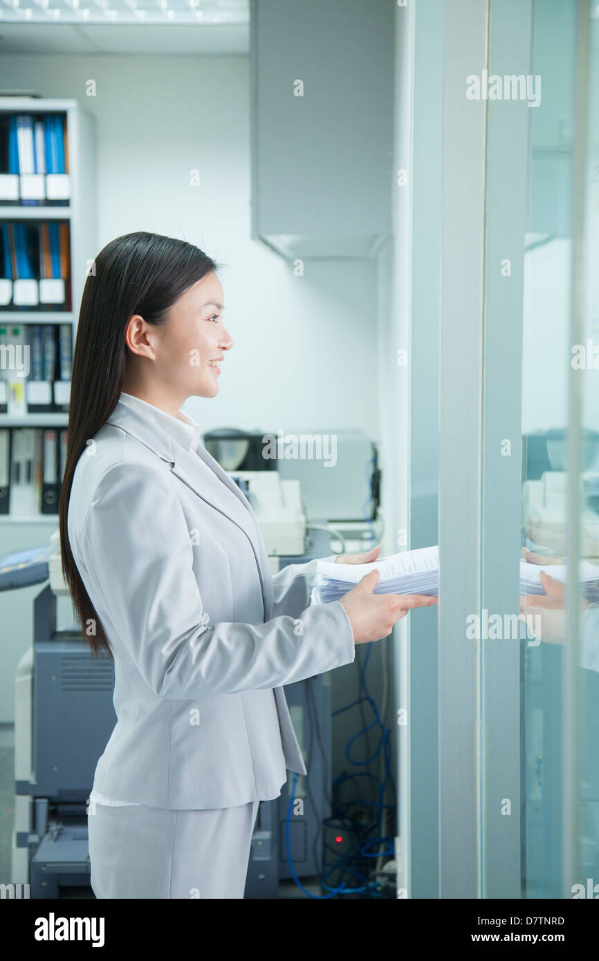 Handing paper hi-res stock photography and images - Alamy