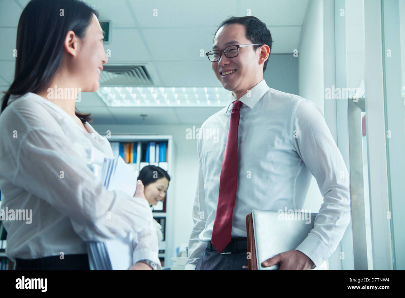 Businesspeople Talking at Work Stock Photo - Alamy