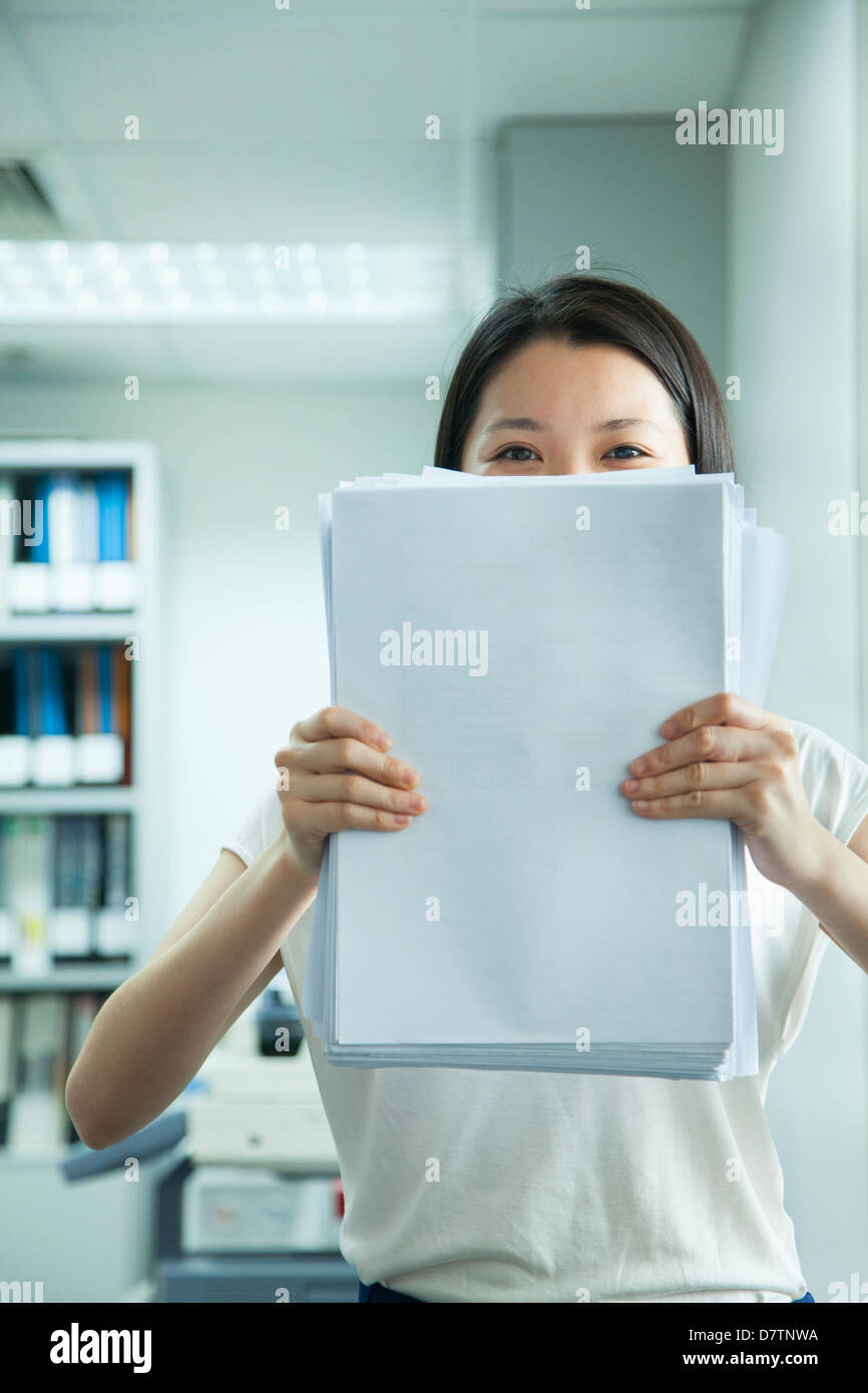 Businesswoman Hiding Behind Paper Stock Photo - Alamy